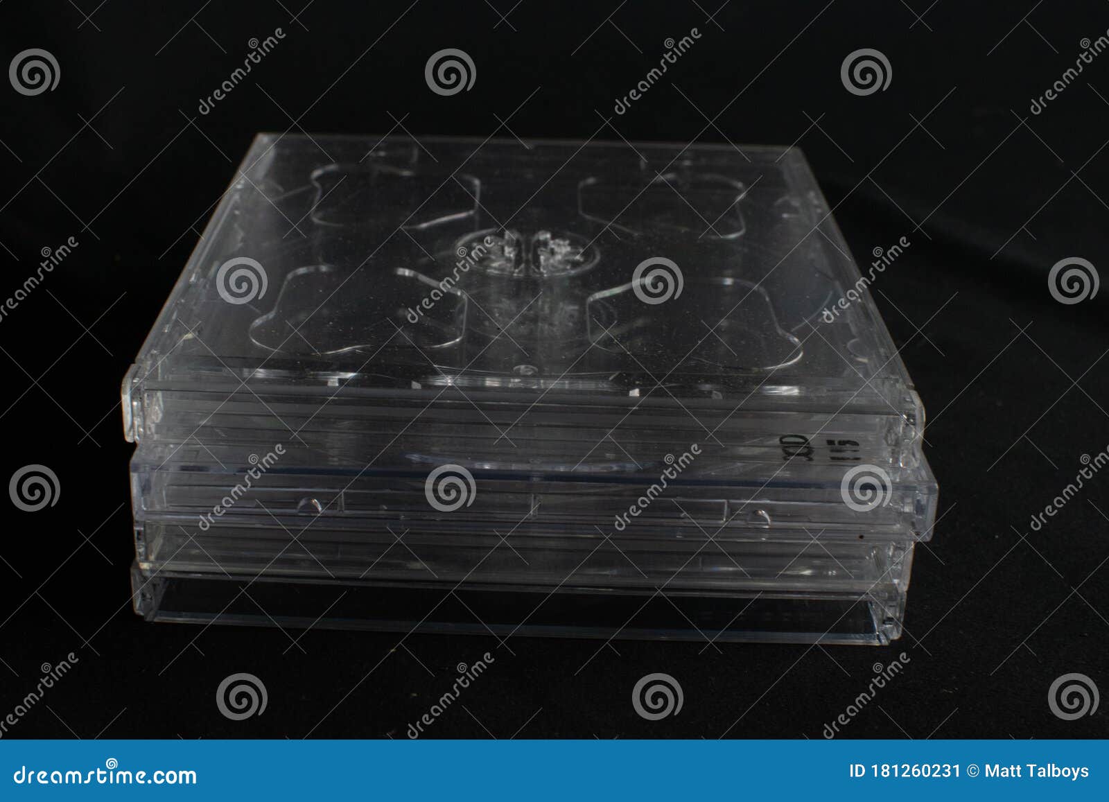Stack of Clear Retro CD Cases with No Compact Discs Against a Black ...