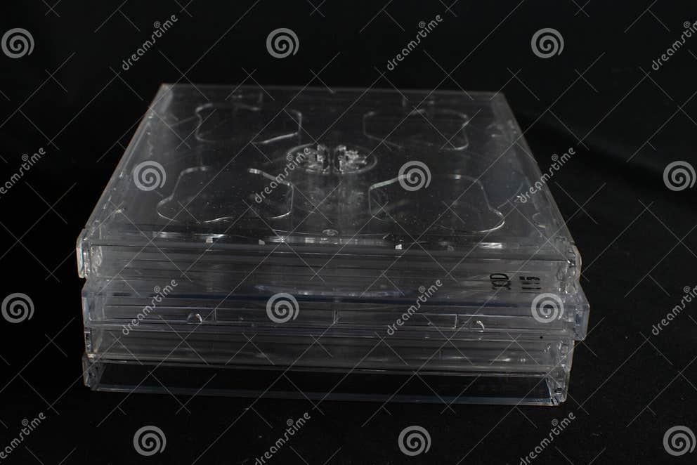 Stack of Clear Retro CD Cases with No Compact Discs Against a Black ...