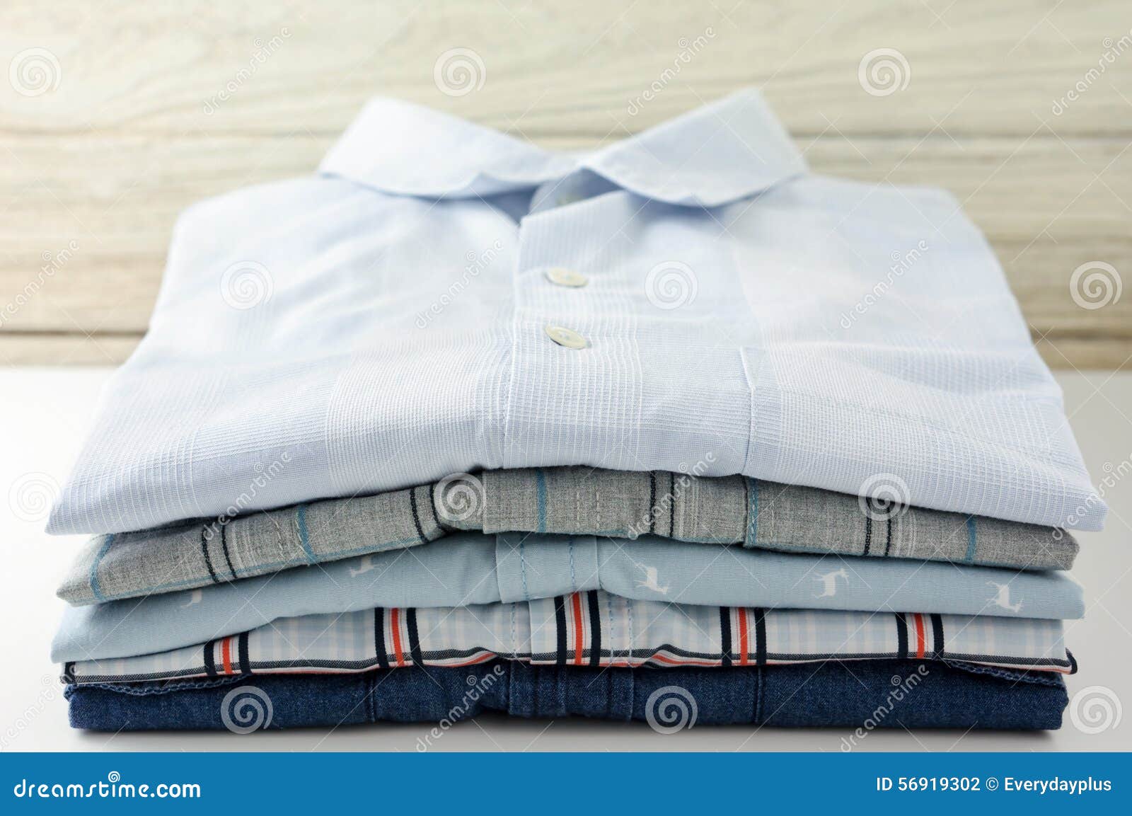 Stack of clothes closeup stock photo. Image of tartan - 56919302