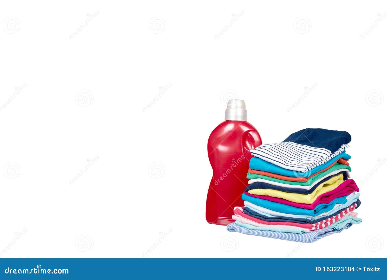 Stack of Clothes and Detergent Bottle, Fresh Laundry Textile Stock ...