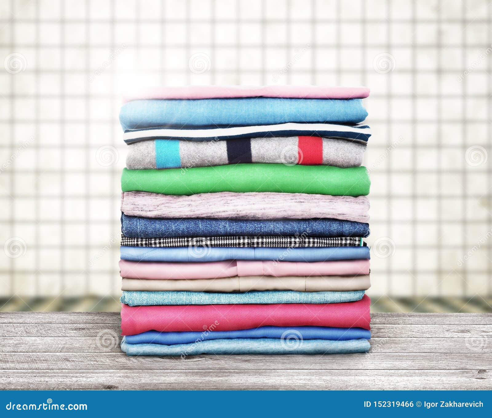 Stack of Clothes in a Laundry Room Stock Photo - Image of clothes ...