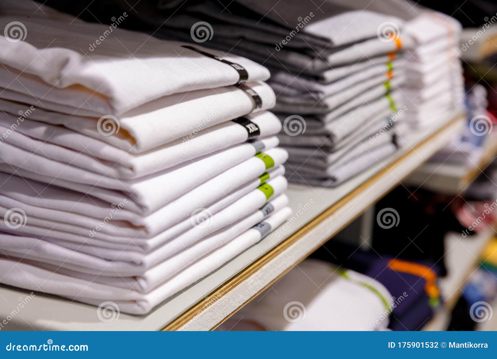 Stack of Clothes in a Shopping Center Stock Photo - Image of design ...
