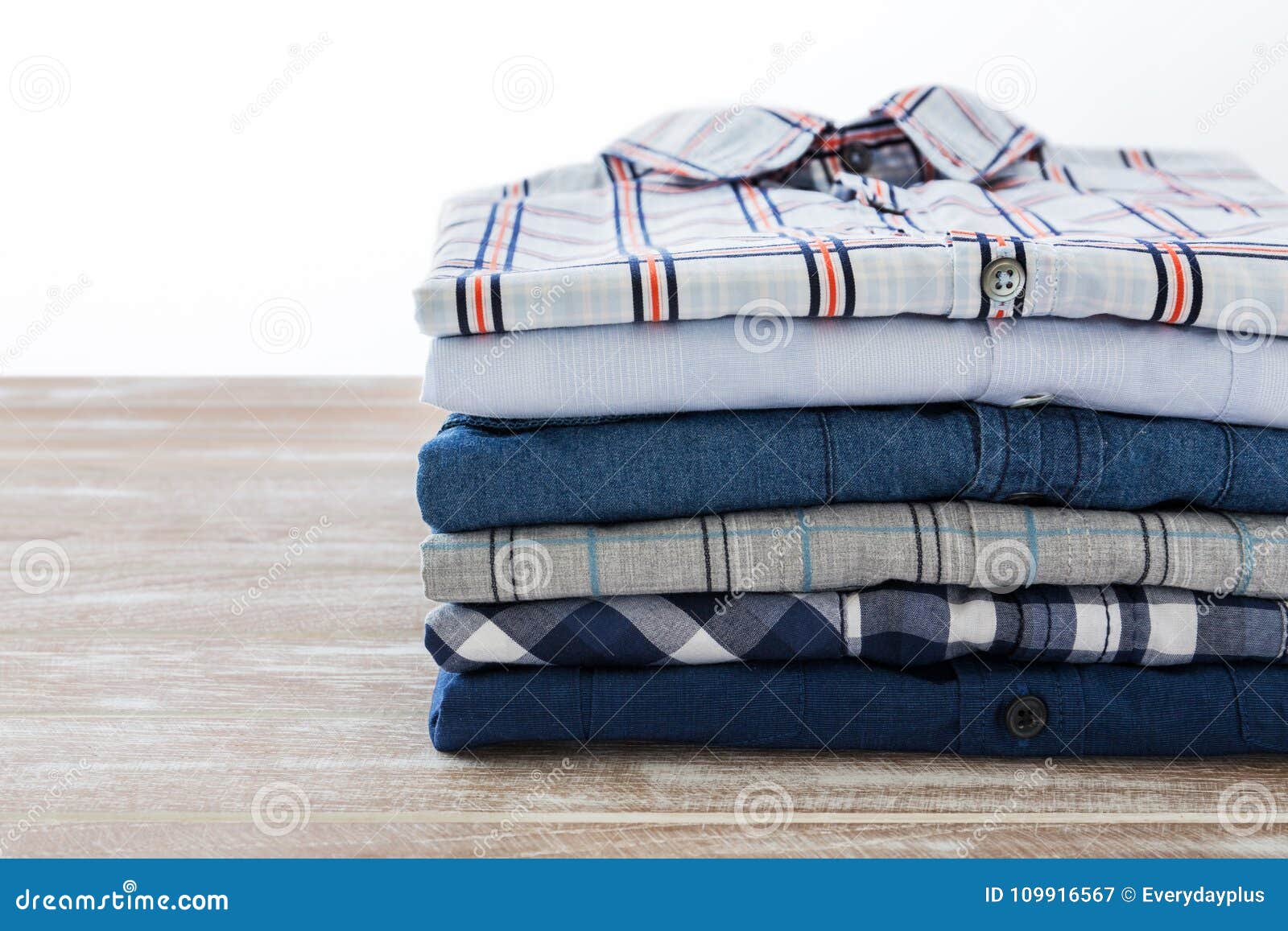 Stack of clothes stock image. Image of wooden, folded - 109916567