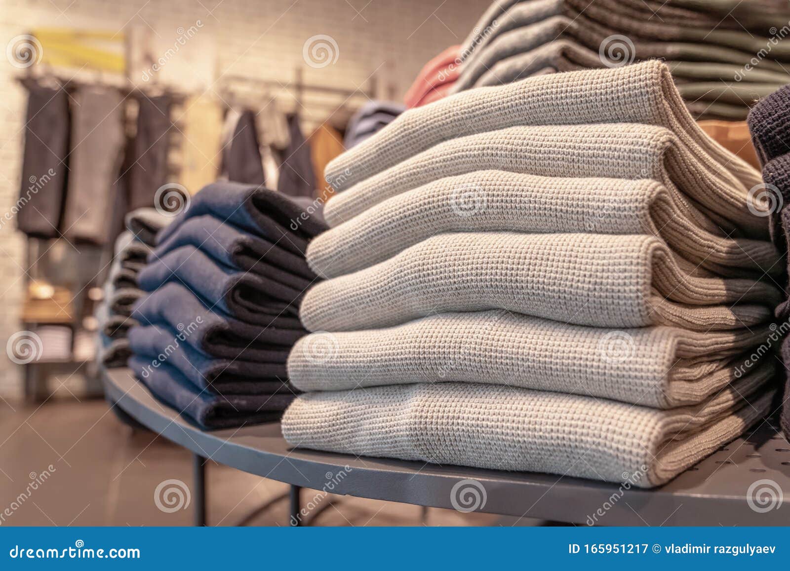 A Stack of Clothes in the Store, Pullovers and Sweatshirts Nicely and ...
