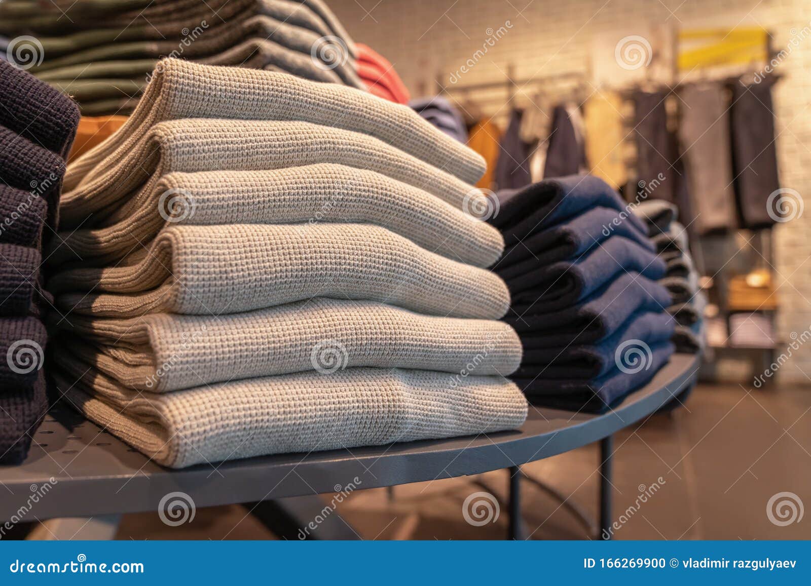 A Stack of Clothes in the Store, Pullovers and Sweatshirts Nicely and ...