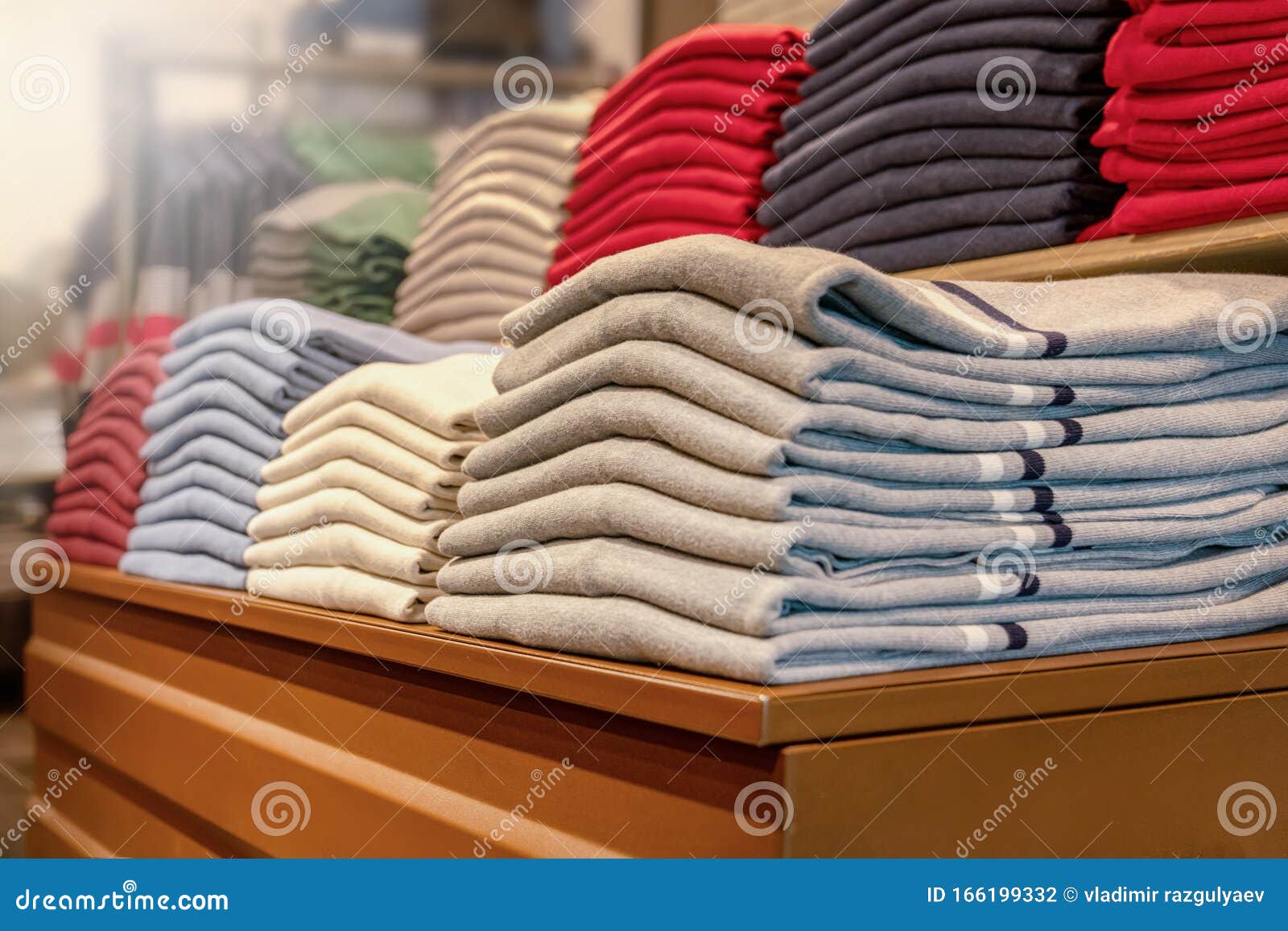 A Stack of Clothes in the Store, Pullovers and Sweatshirts Nicely and ...