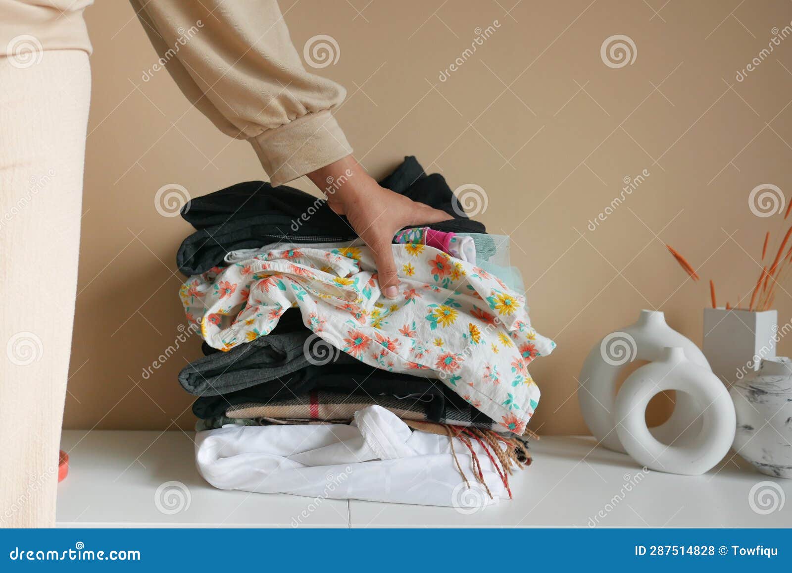 Stack of Clothes on Table Indoor. Stock Photo - Image of fashion ...