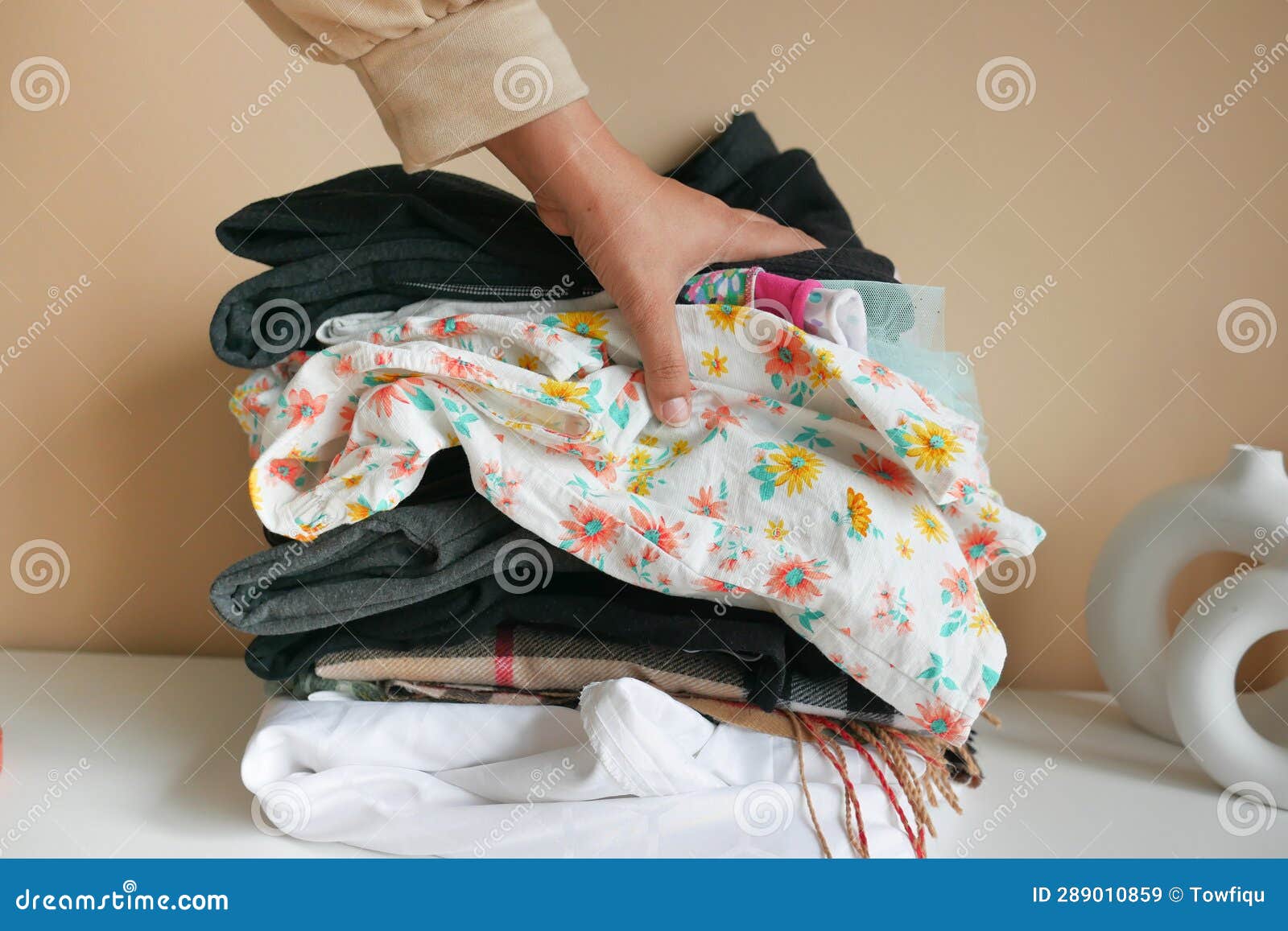 Stack of Clothes on Table Indoor. Stock Image - Image of stack, folded ...