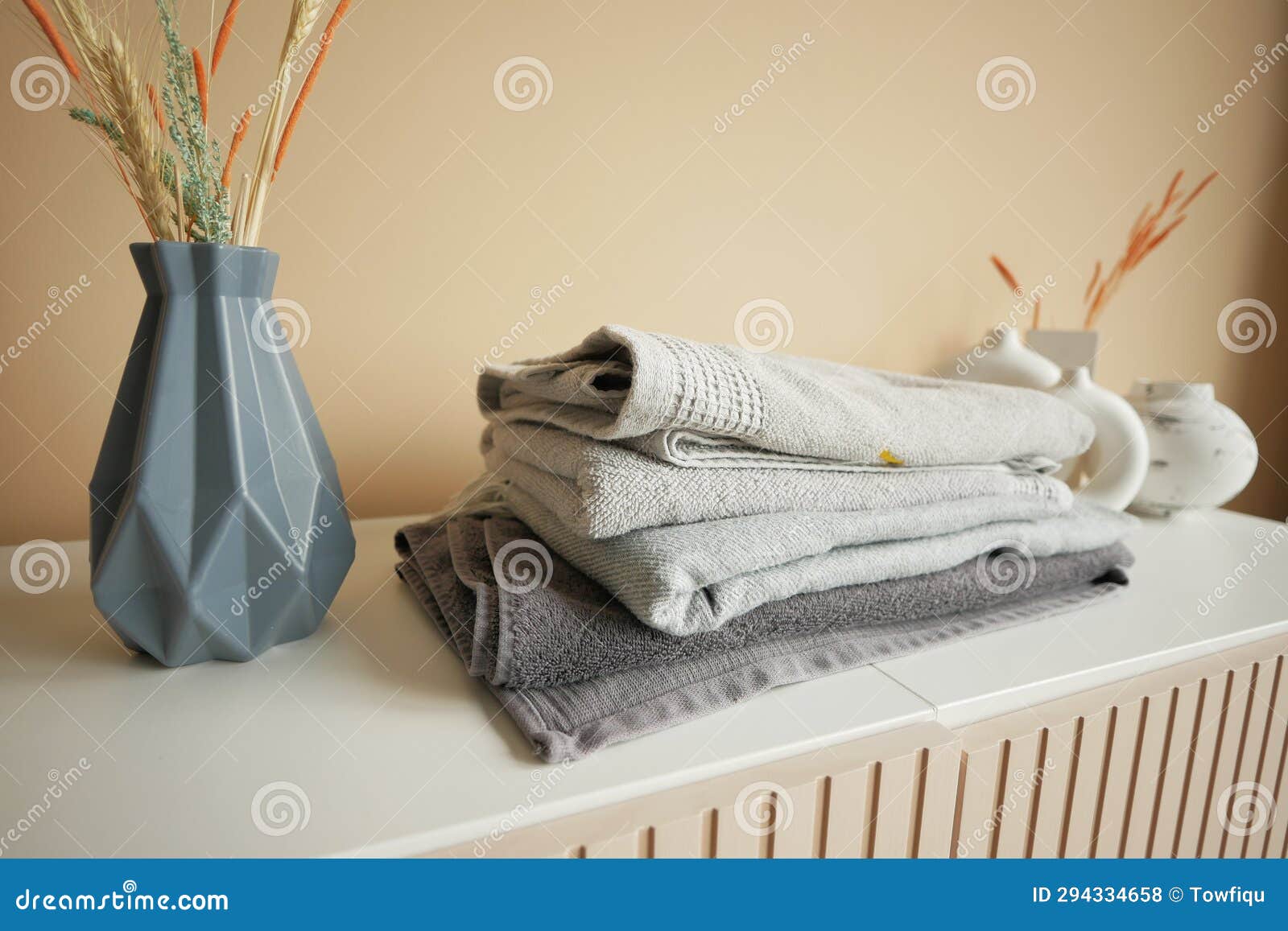 Stack of Clothes on Table Indoor. Stock Photo - Image of shirt, garment ...