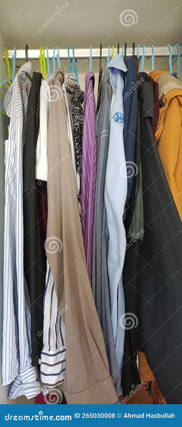 A Stack of Clothes in a Wardrobe Stock Photo - Image of wardrobe ...
