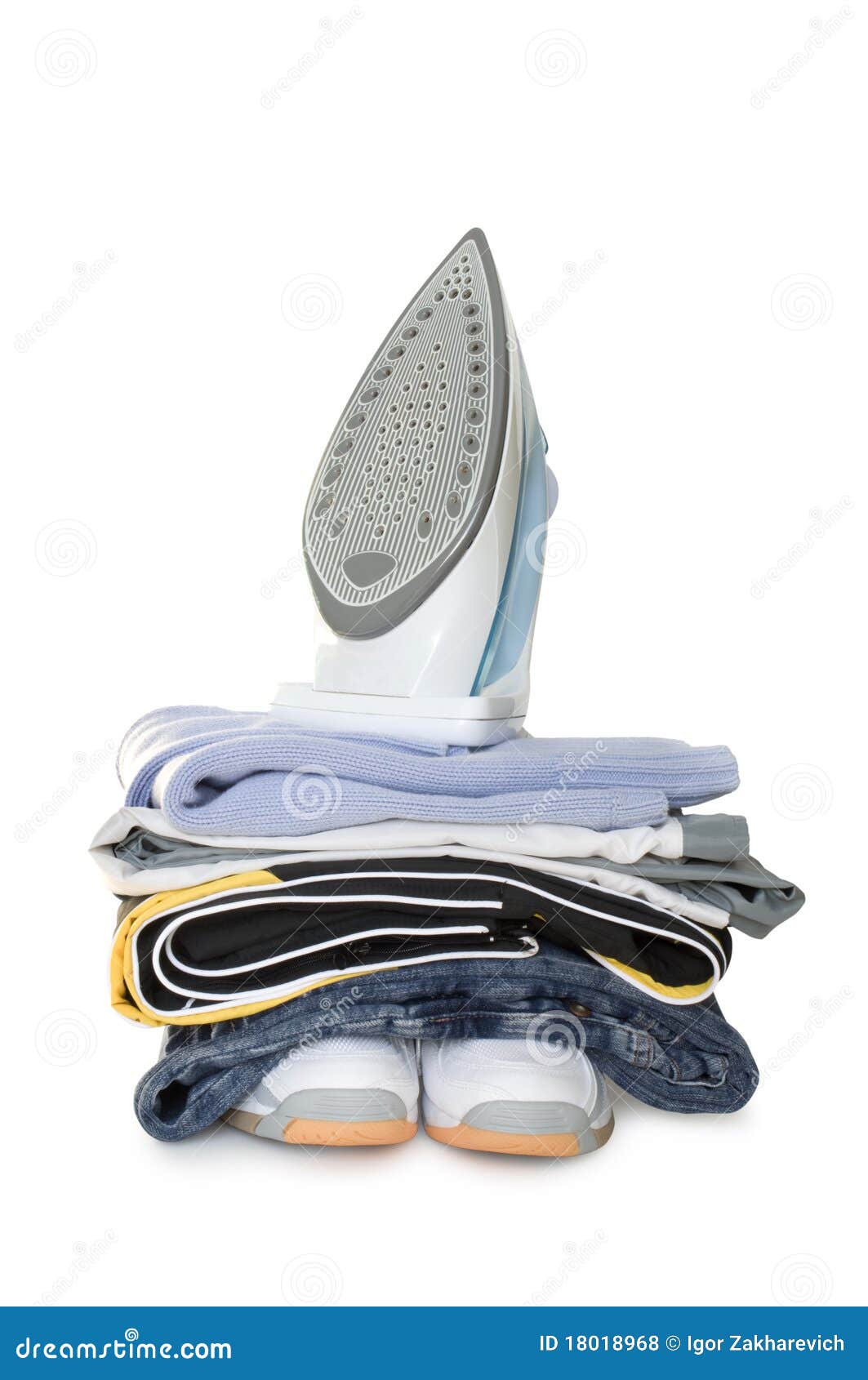 Stack of clothing and iron stock photo. Image of jeans - 18018968