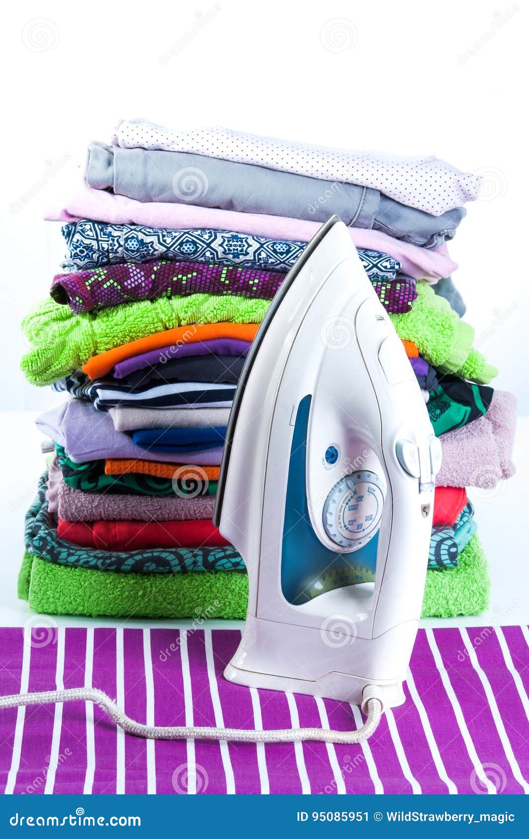Stack of Clothing and Iron on a White Background Stock Image - Image of ...