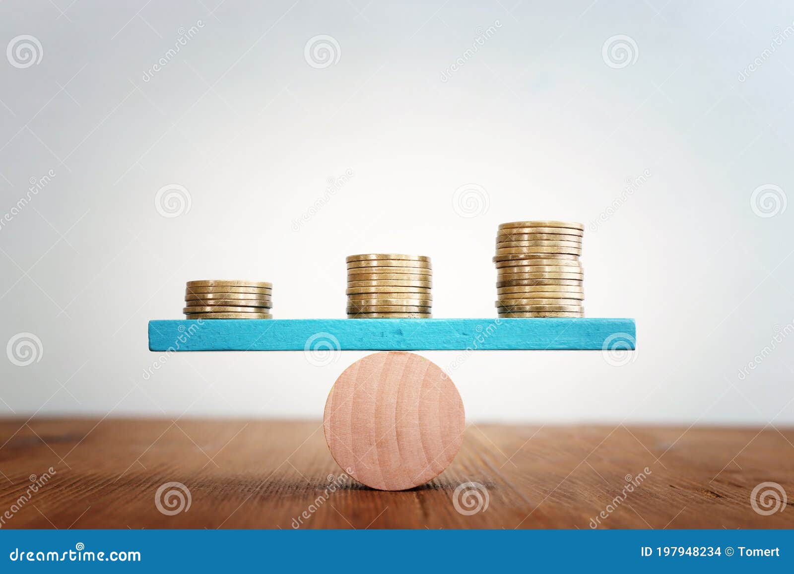 Stack of Coins Balance on Seesaw Stock Photo - Image of conceptual ...