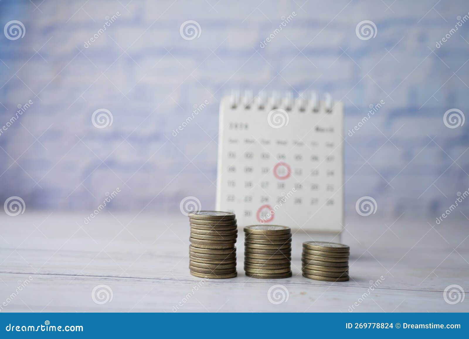 Stack of Coins and Calendar on Table Stock Photo - Image of circle ...