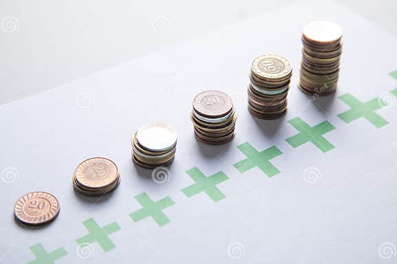 Stack of Coins with a Growing Plus Signs Stock Photo - Image of ...