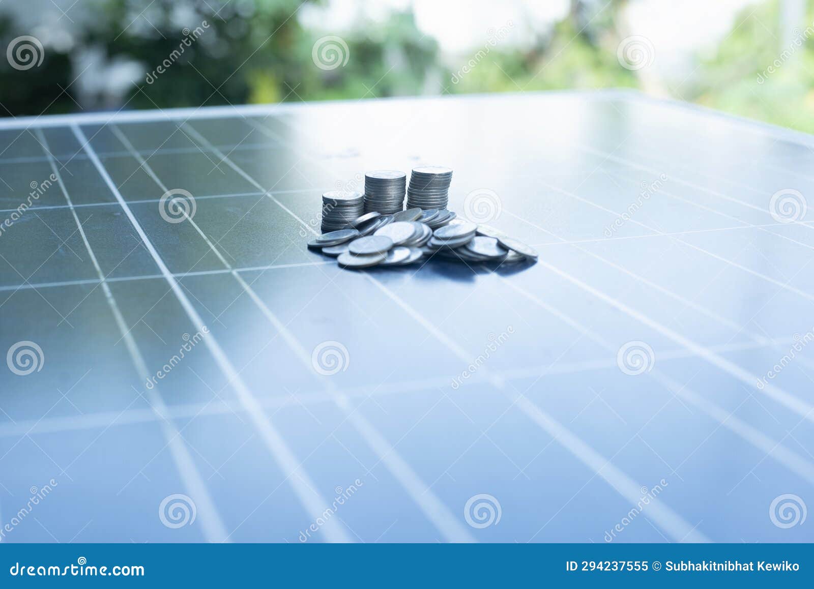 Stack of Coins on Solar Panel the Idea of Installing Solar Cells Gives ...