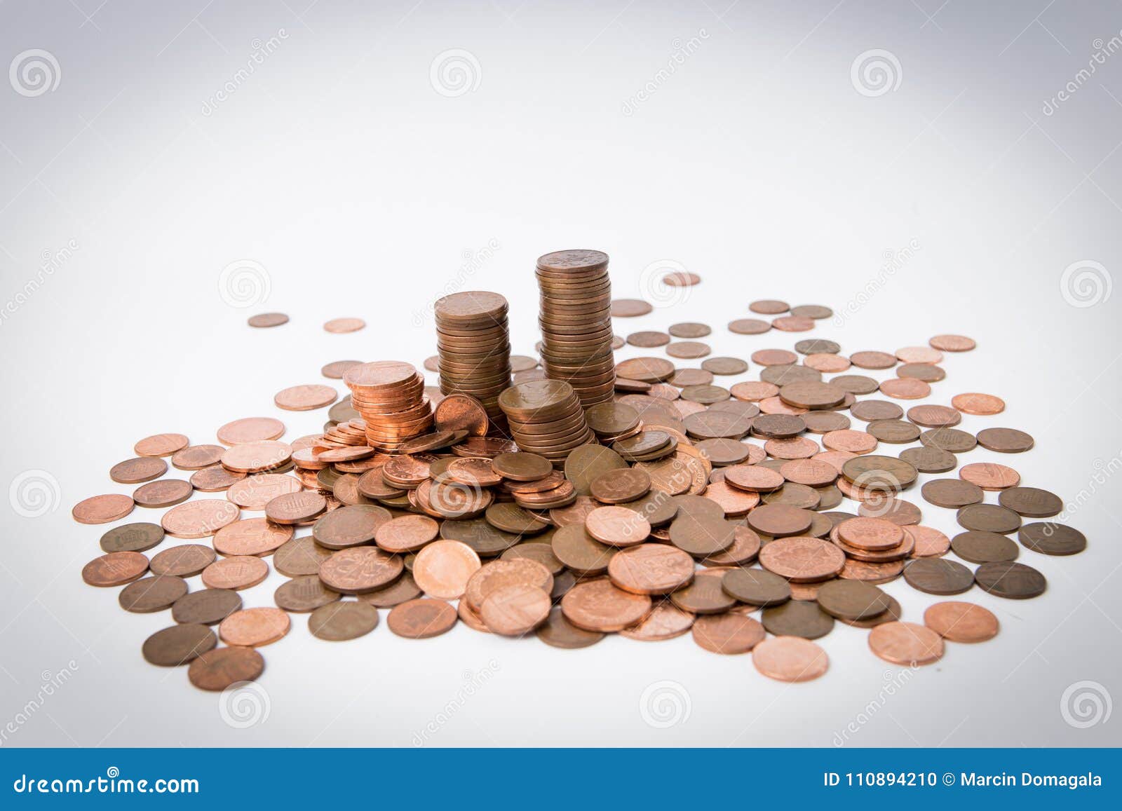 A Stack of Coins at the White Background Surrounded by Other Coins ...