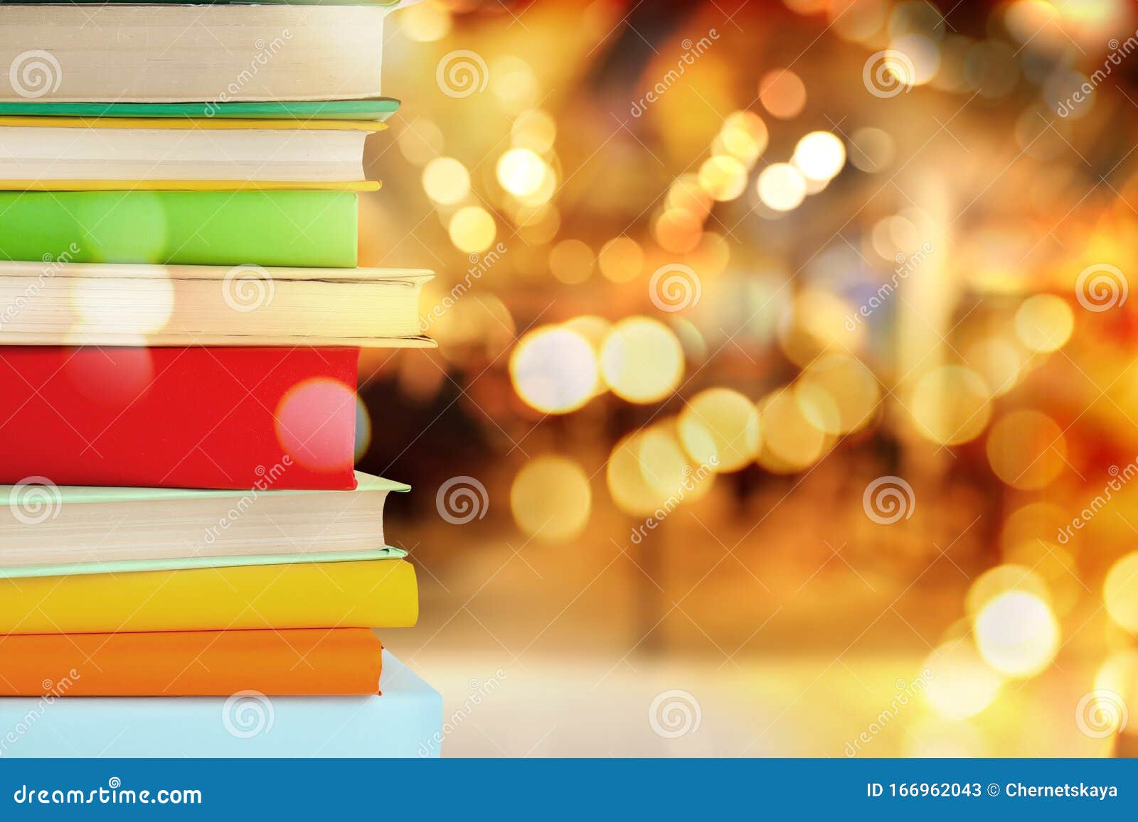 Stack of Colorful Books on Background, Space for Text. Bokeh Effect ...