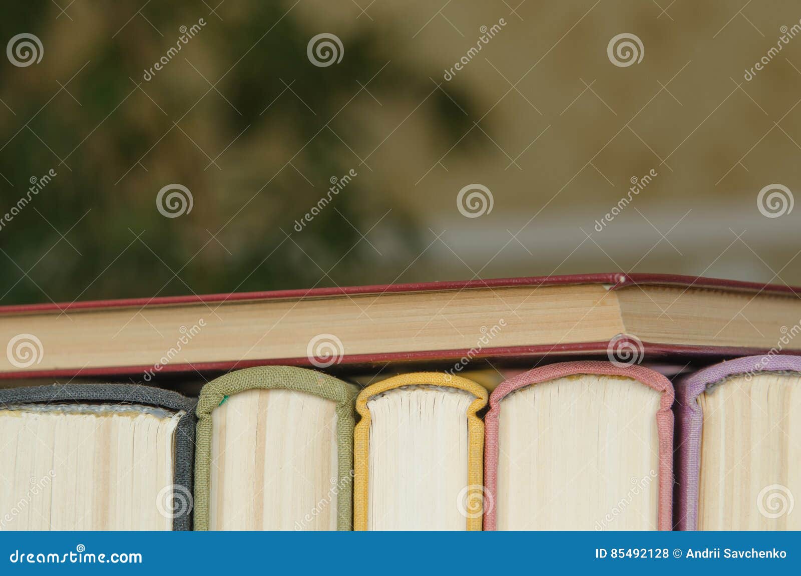 A Stack of Colorful Books in a Library Stock Photo - Image of isolated ...