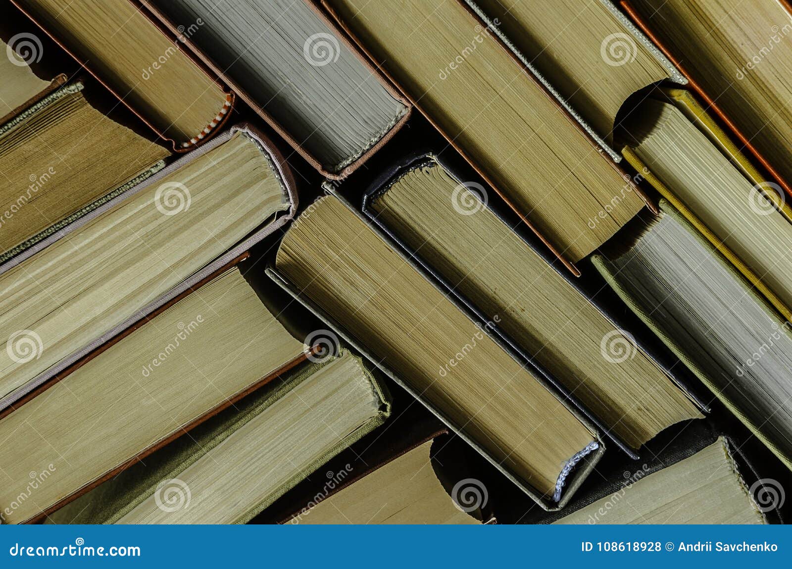 A Stack of Colorful Books in a Library Stock Photo - Image of brown ...