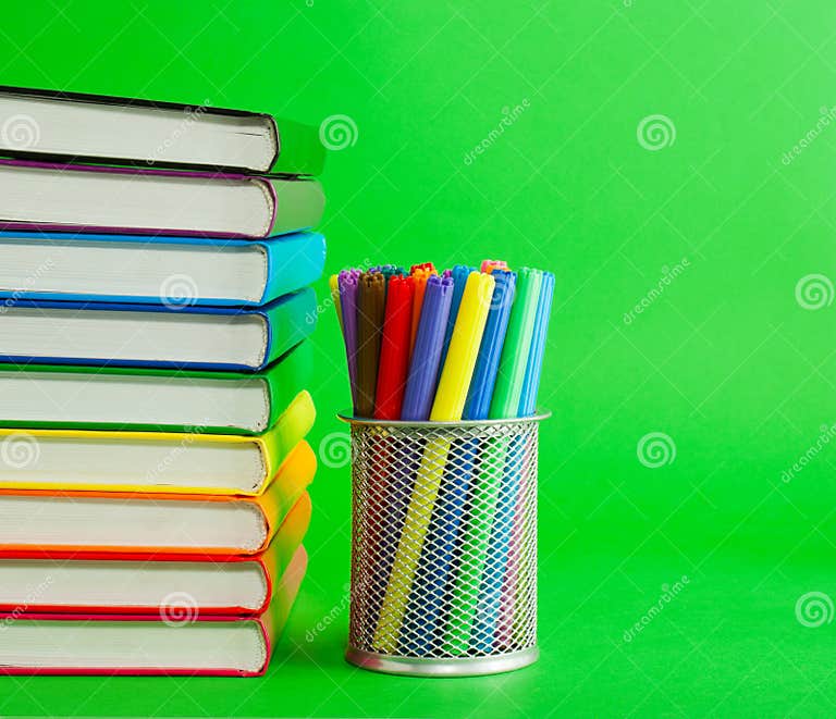 Stack of Colorful Books and Socket with Felt Pens Stock Photo - Image ...