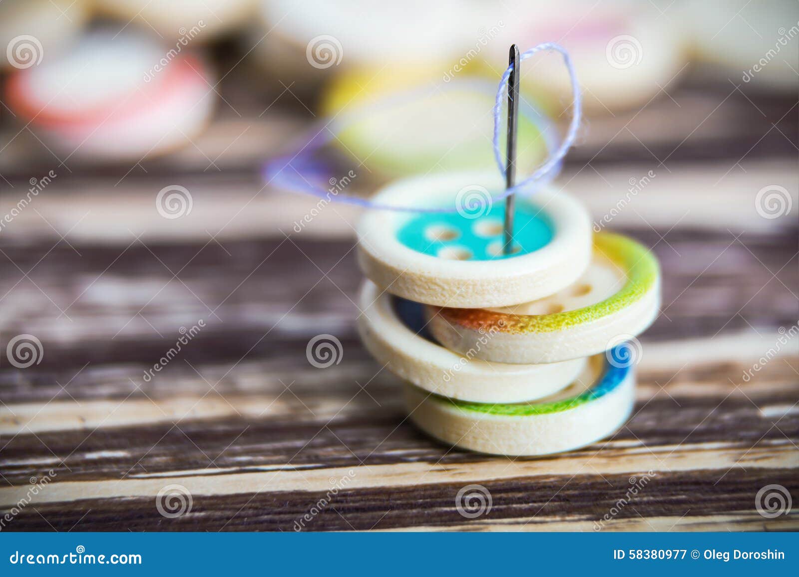 Stack of Colorful Buttons with Sewing Needle Stock Image - Image of ...