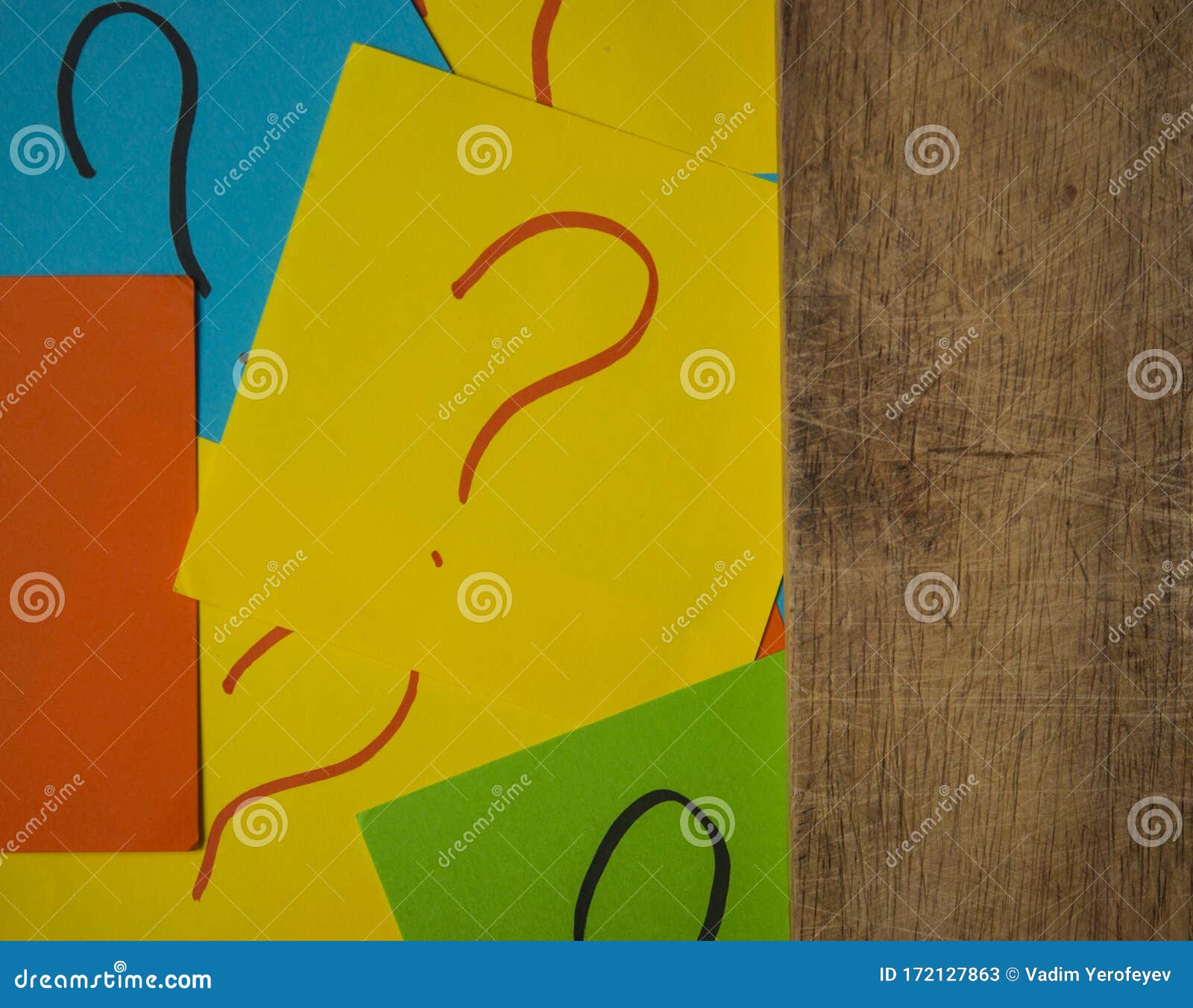 Stack of Colorful Cards with a Question Mark on the Old Wooden ...