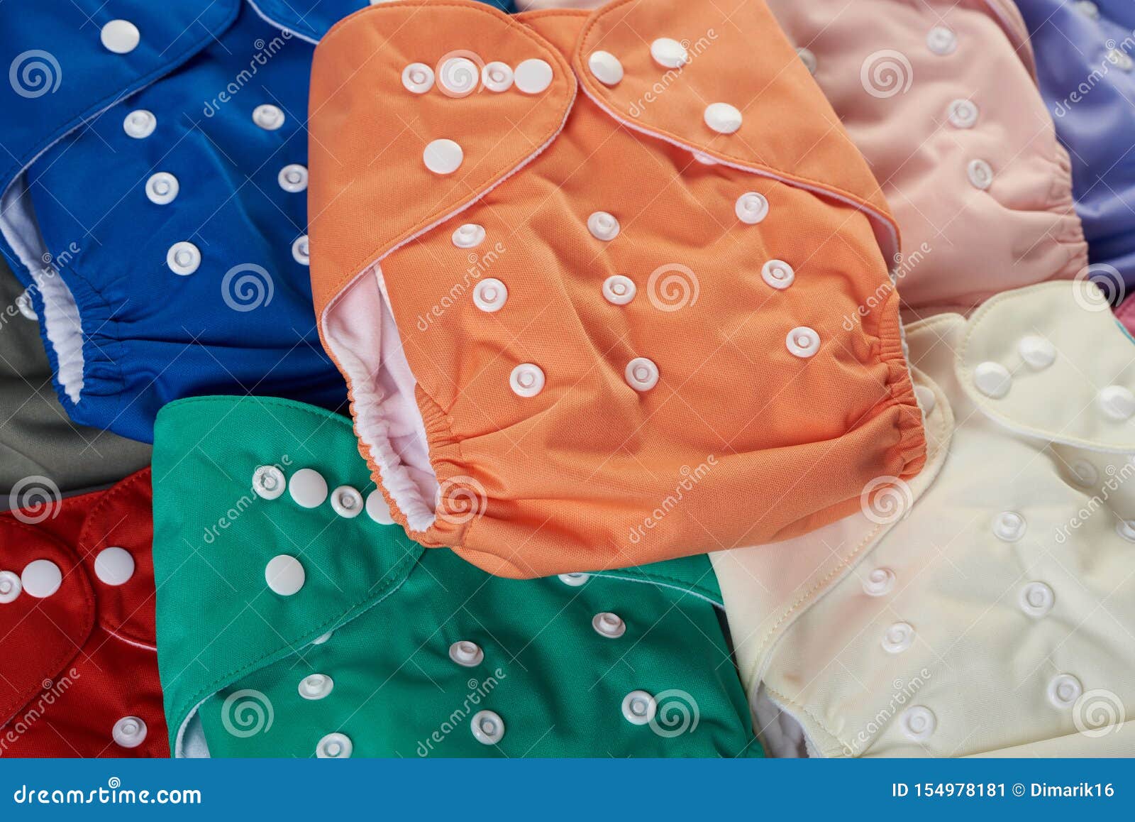Stack of colorful diapers stock image. Image of background - 154978181