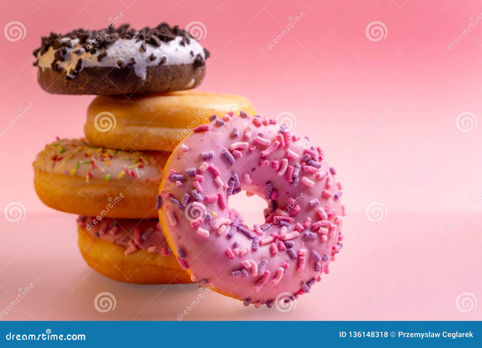 Stack of Colorful Donuts on Pink Background. Stock Photo - Image of ...