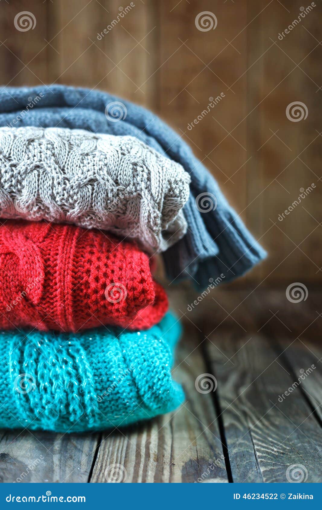 Stack of Colorful Knitted Sweaters on Wooden Stock Photo - Image of ...