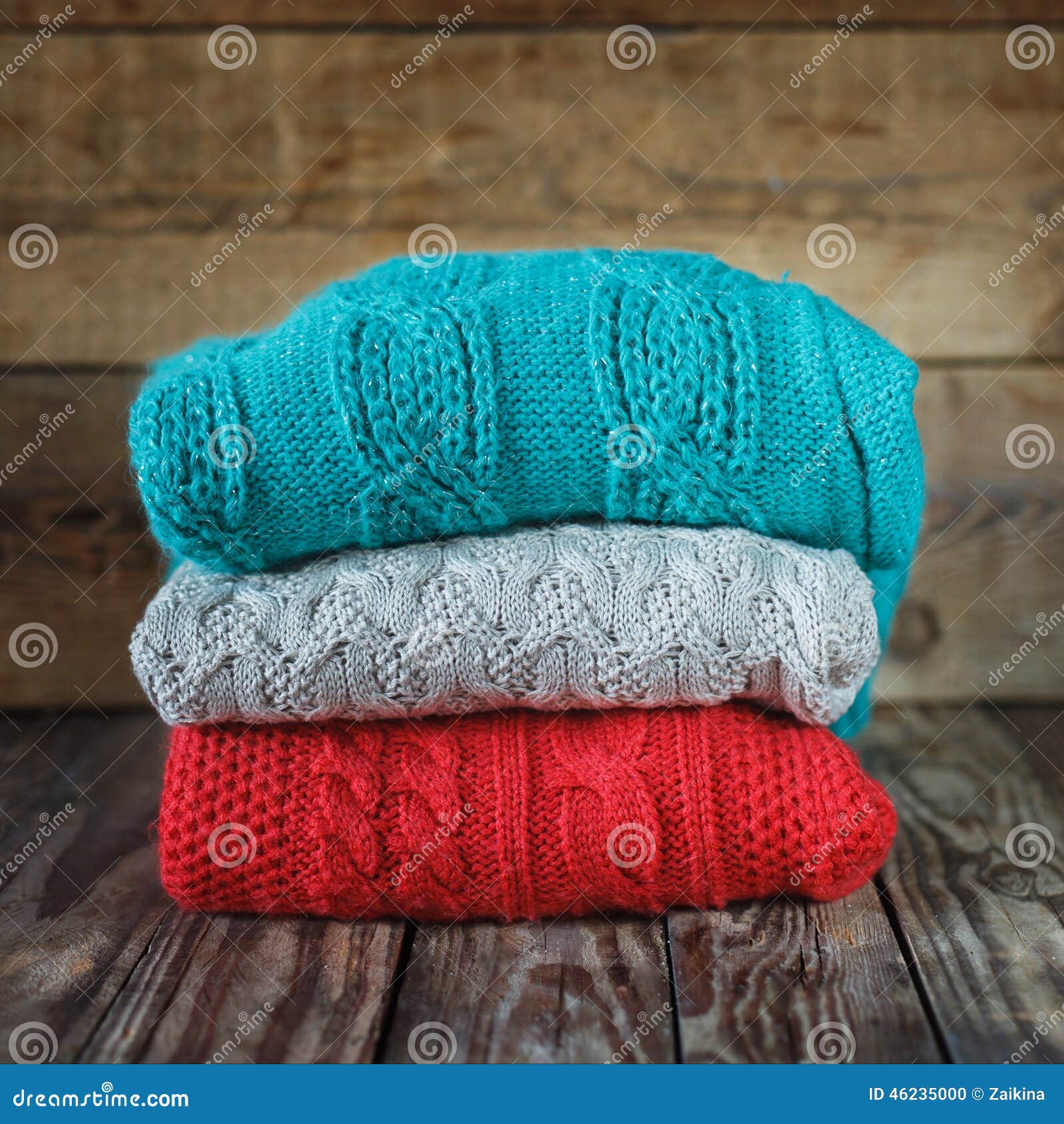 Stack of Colorful Knitted Sweaters on Wooden Stock Photo - Image of ...