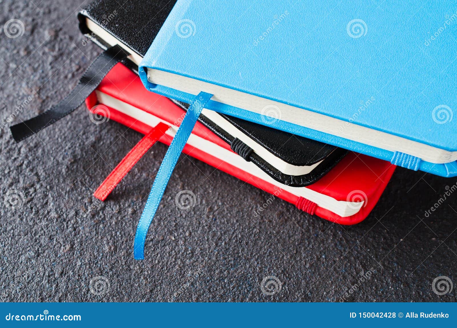 Stack of Colorful Notebooks for Writing or Books on Dark Background ...