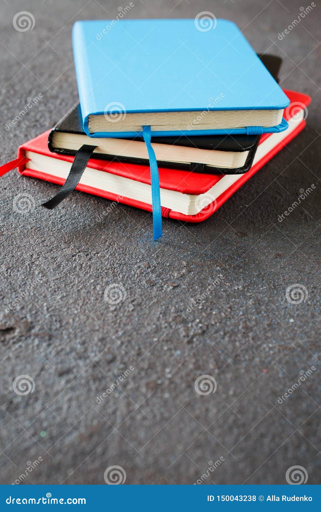 Stack of Colorful Notebooks for Writing or Books on Dark Background ...