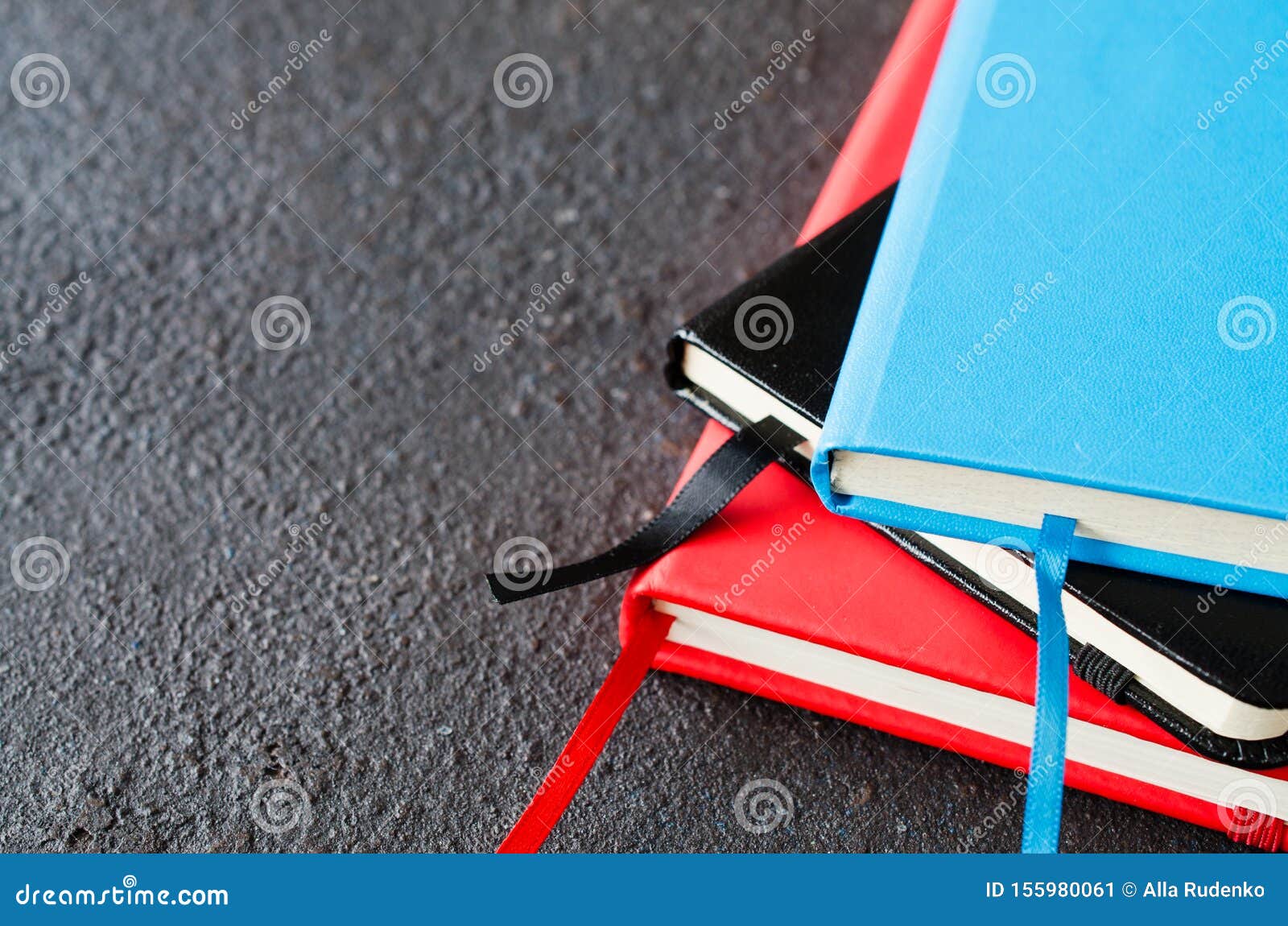 Stack of Colorful Notebooks or Books on Dark Background Stock Image ...