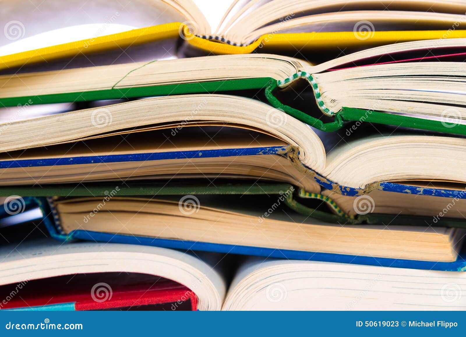 A Stack of Colorful, Open Books on a White Background Stock Image ...