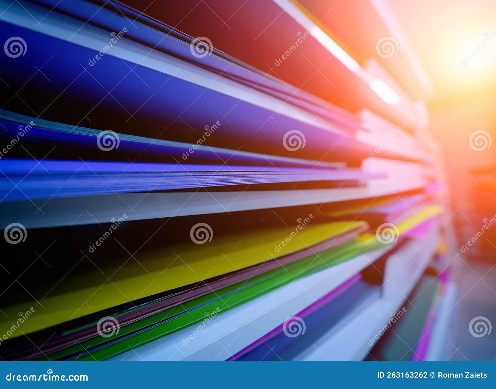 A Stack of Colorful Paper Folded in a Warehouse Stock Photo - Image of ...