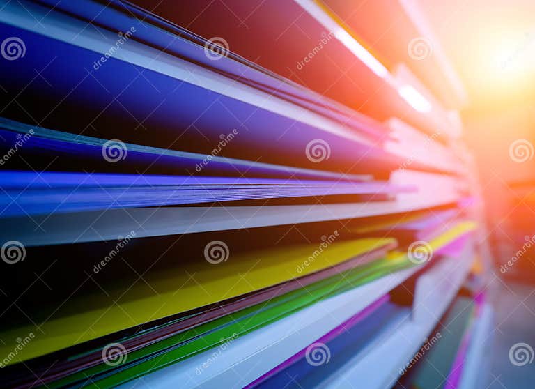 A Stack of Colorful Paper Folded in a Warehouse Stock Photo - Image of ...