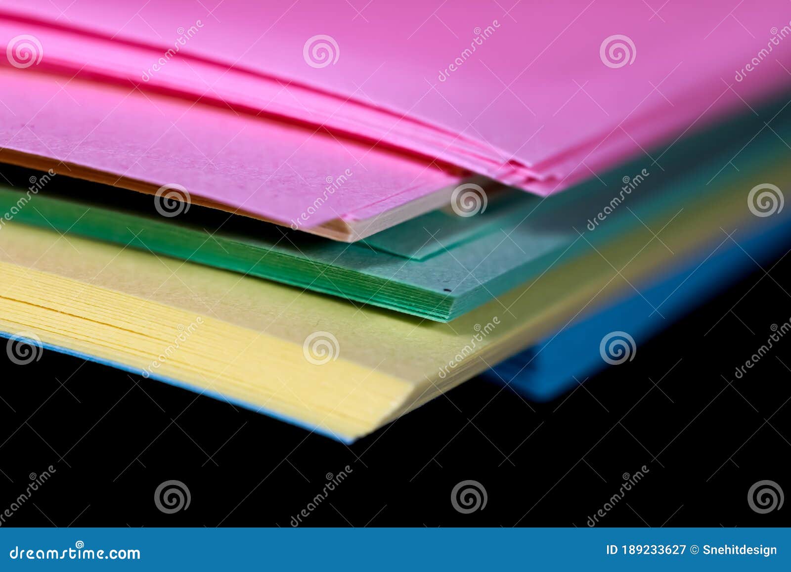 Stack of Colorful Papers on Black Background Stock Image - Image of ...