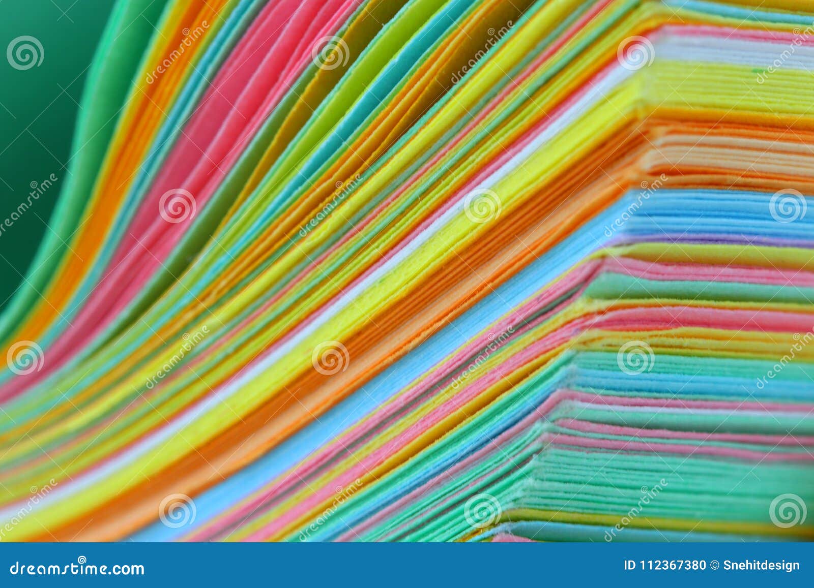 Stack of colorful papers stock photo. Image of read - 112367380