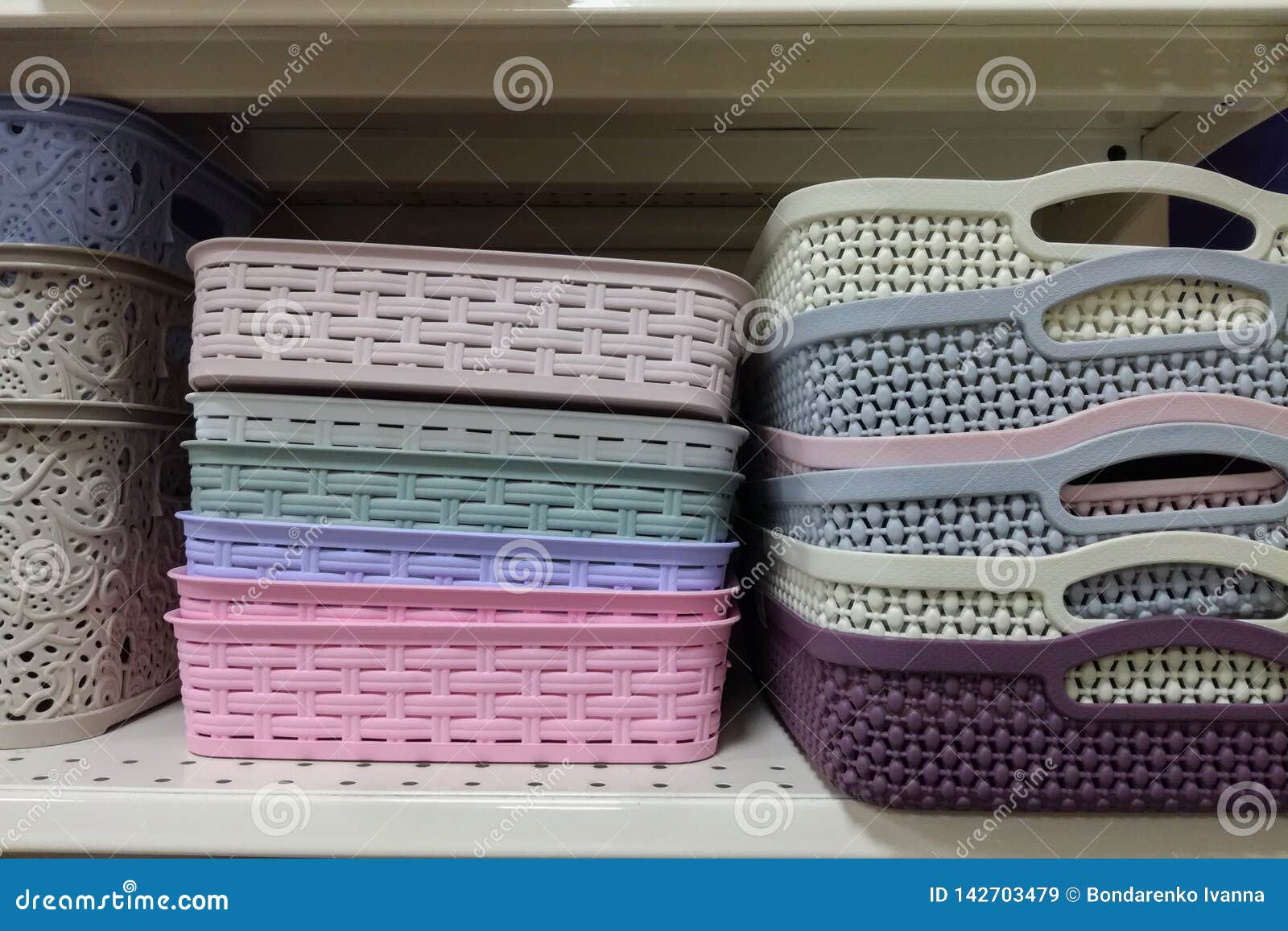 Stack of Colorful Plastic Baskets on the Shelf Stock Image - Image of ...