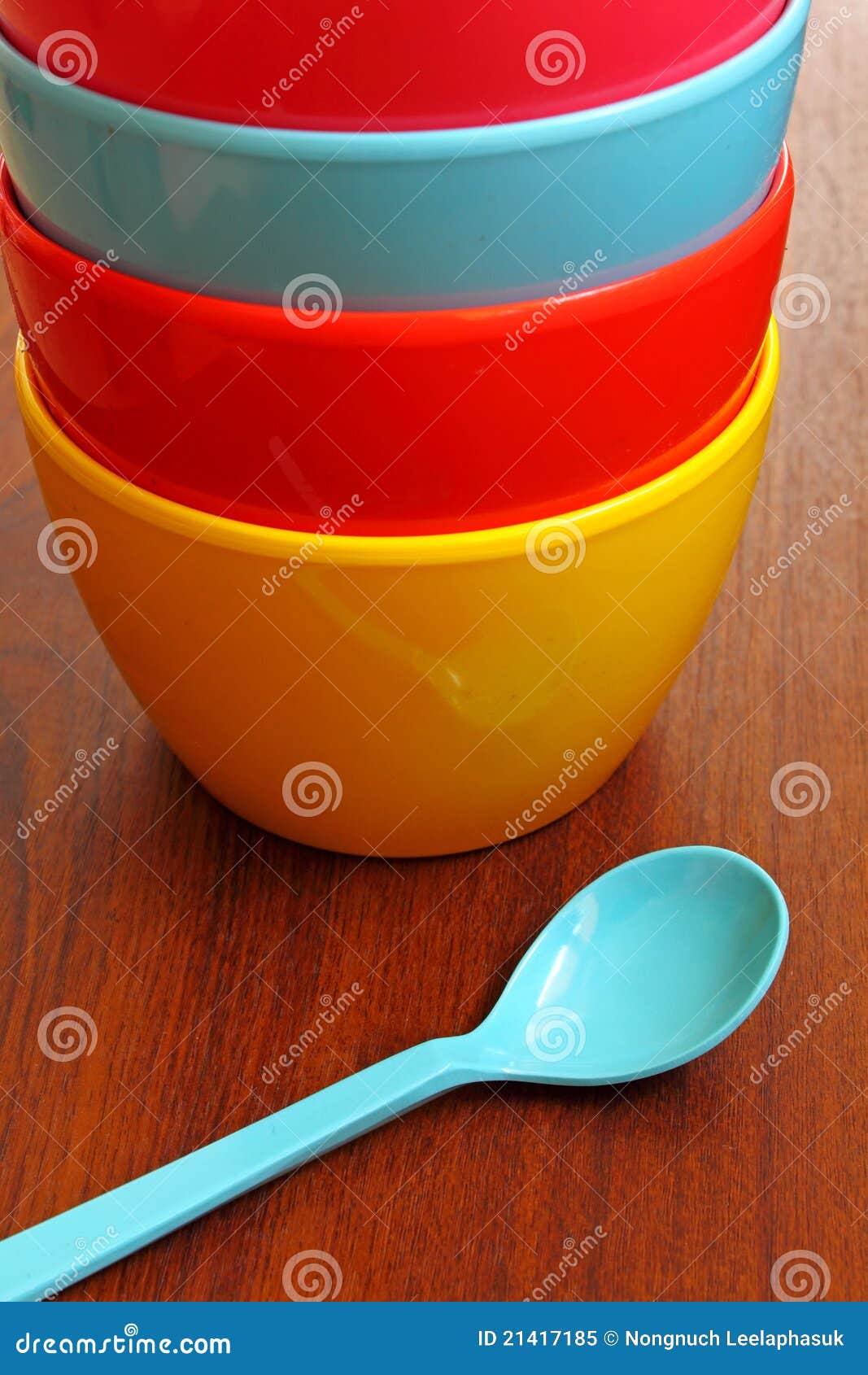 Stack of Colorful Plastic Bowl with Blue Spoon Stock Image - Image of ...
