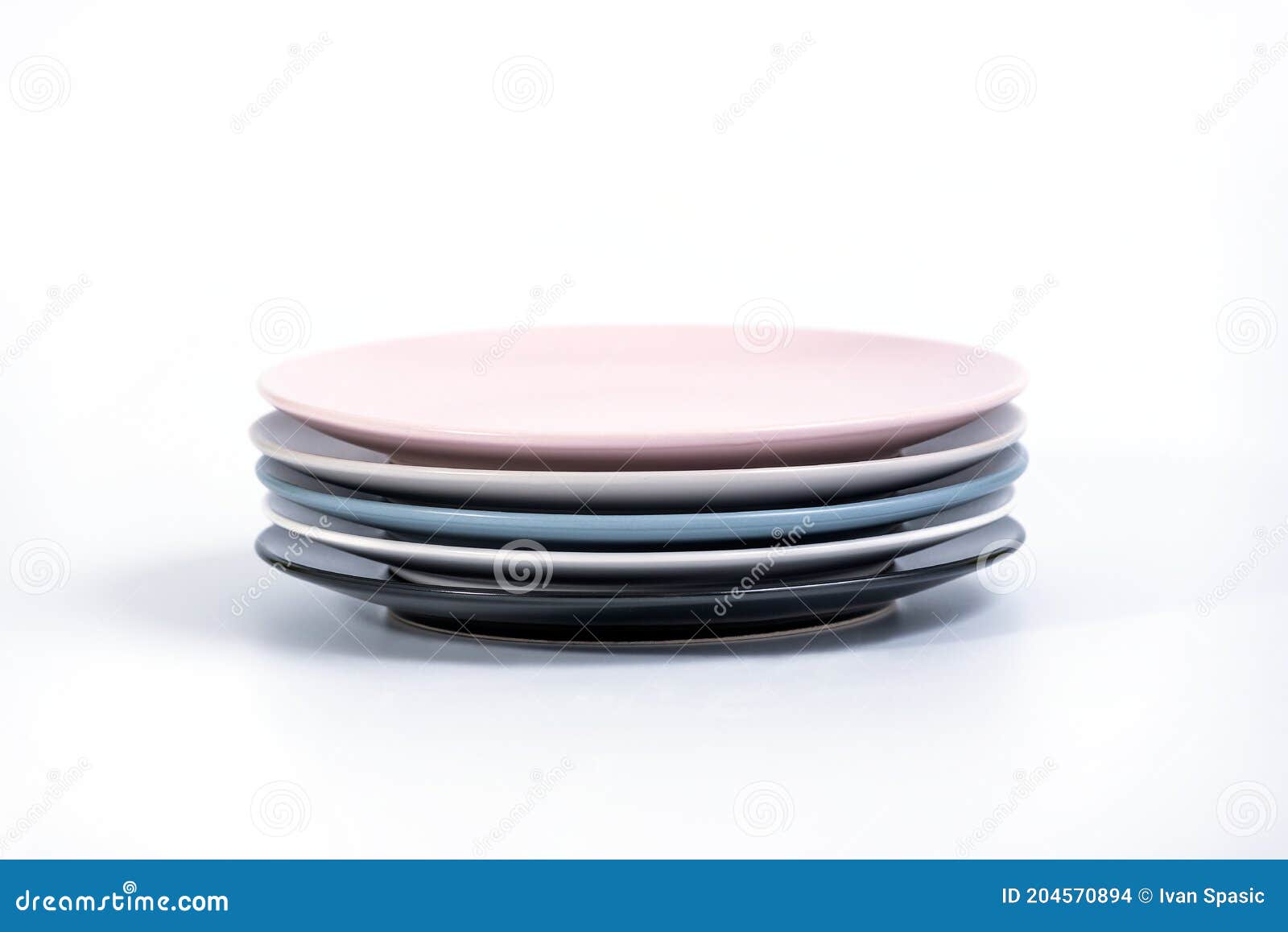 Stack of Colorful Plates Isolated on White Background Stock Photo ...