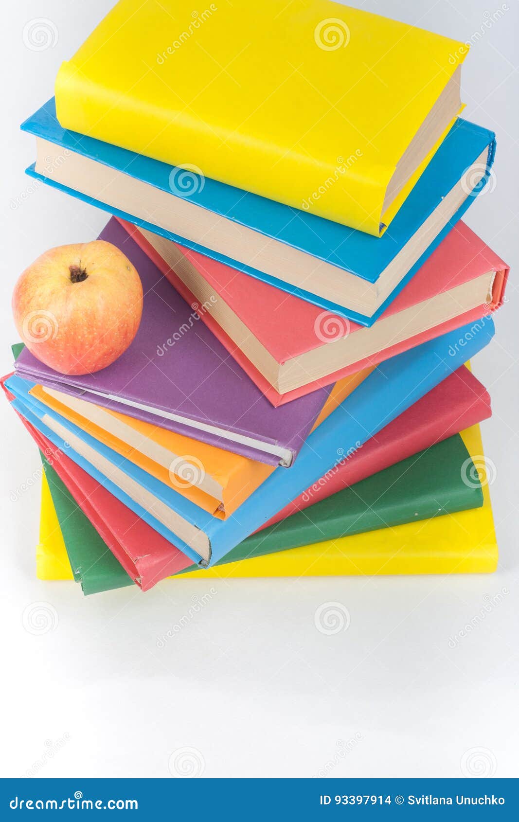 Stack of Colorful Real Books, Apple on White Background, Partial View ...