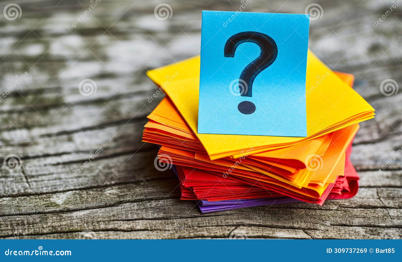 Stack of Colorful Sticky Notes on Wooden Background with a Prominent ...