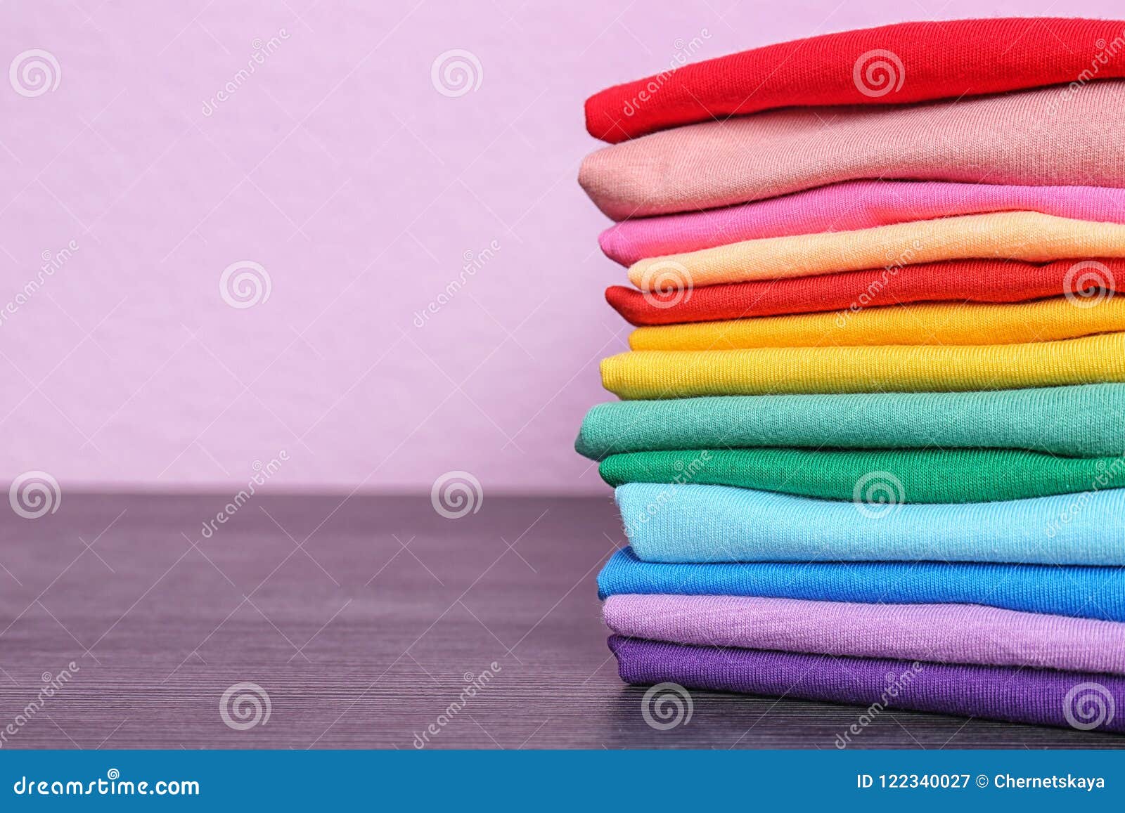Stack of Colorful T-shirts on Table Stock Image - Image of group ...
