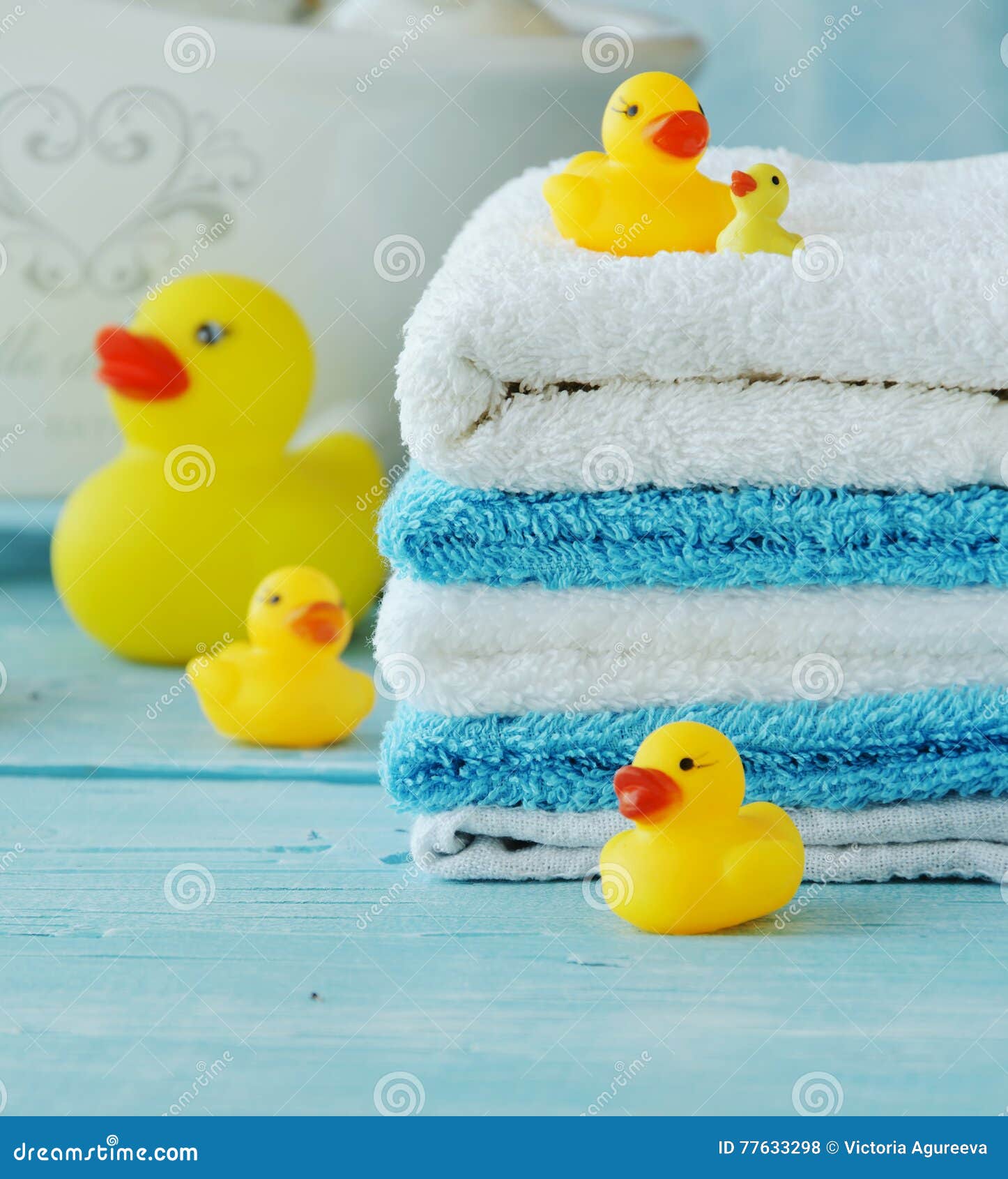 Stack of Colorful Towels and Bath Duck on the Table Stock Photo - Image ...