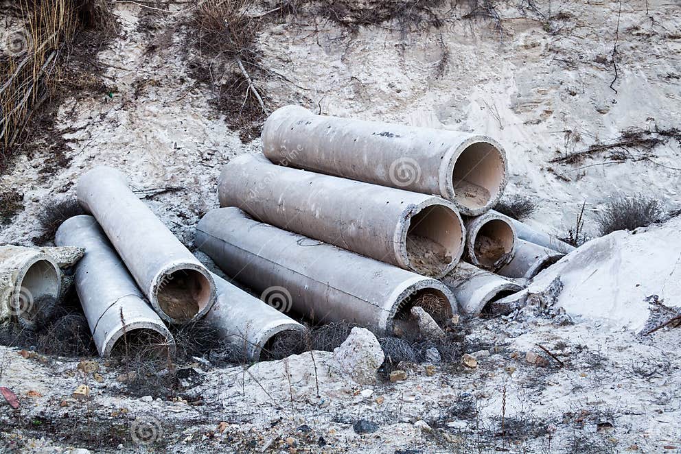 Stack of concrete pipes stock photo. Image of duct, diameter - 153220560