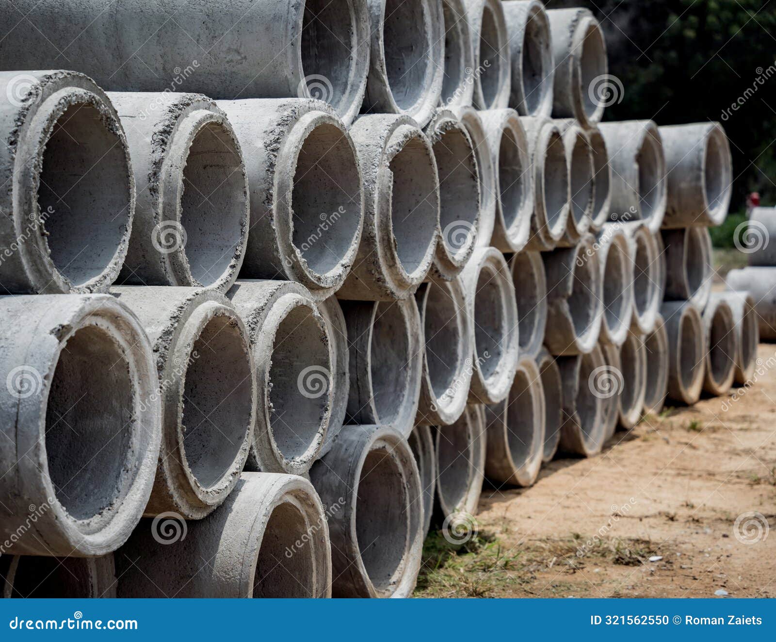 A Stack of Concrete Ring Pipes Piled and Creating a Symmetrical ...