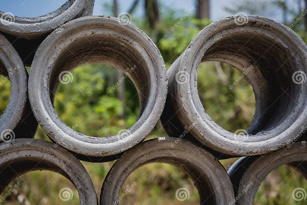 A Stack of Concrete Ring Pipes Piled and Creating a Symmetrical ...
