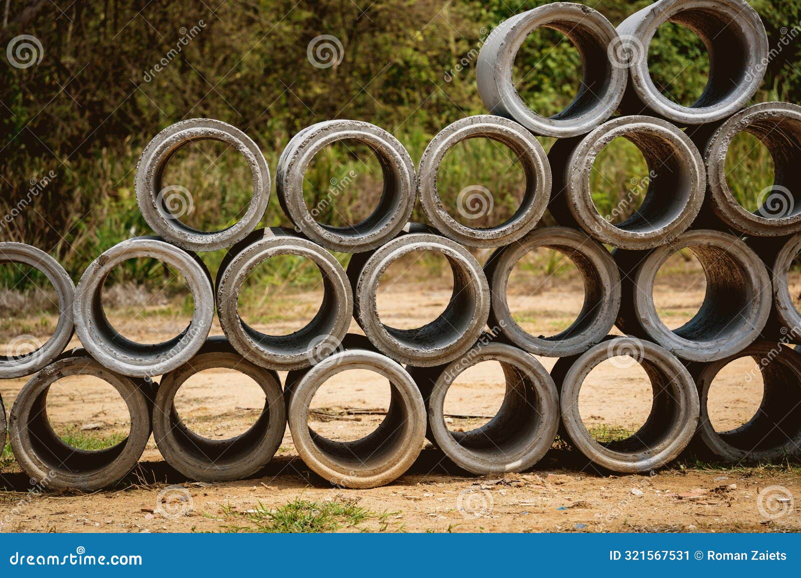 A Stack of Concrete Ring Pipes Piled and Creating a Symmetrical ...